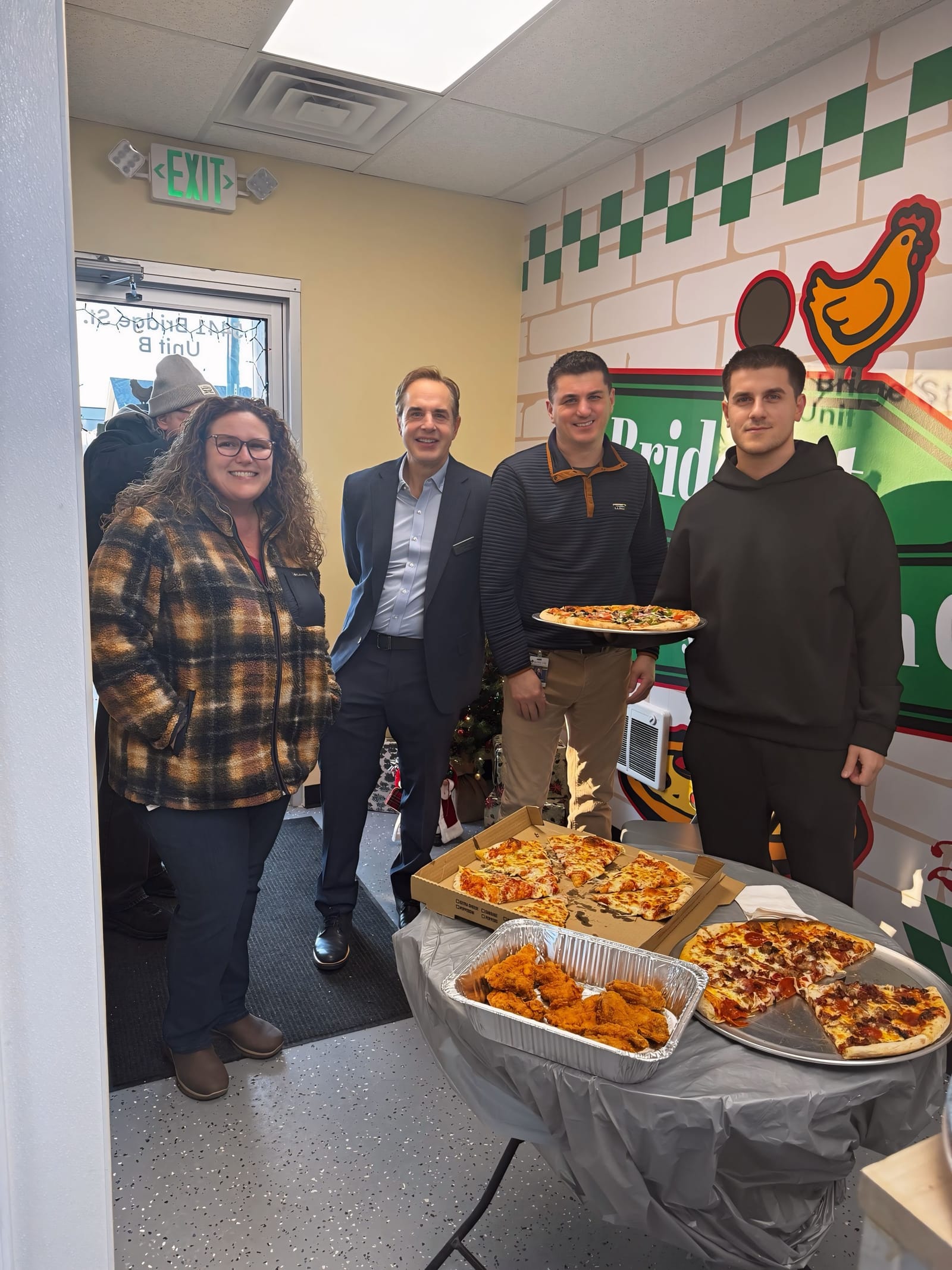 Bridge St. Pizza & Chicken Co. celebrates ribbon cutting in Roscoe